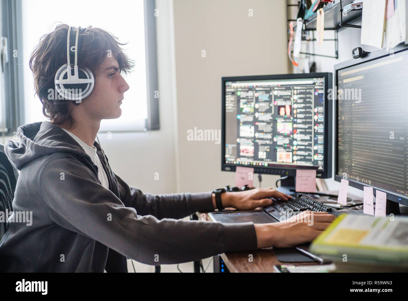 Teenager using a computer Stock Photo - Alamy