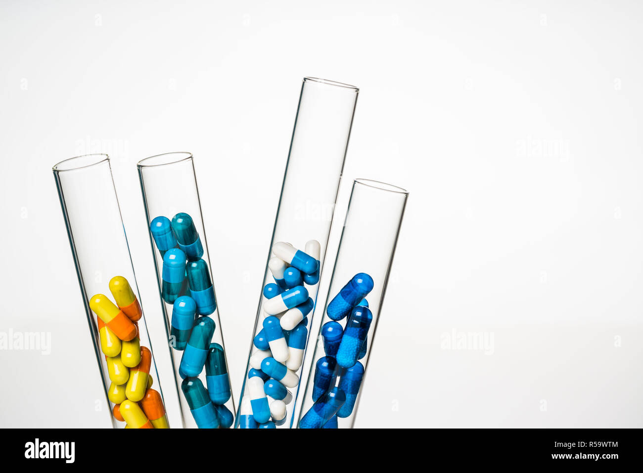 Capsules in test tubes Stock Photo - Alamy