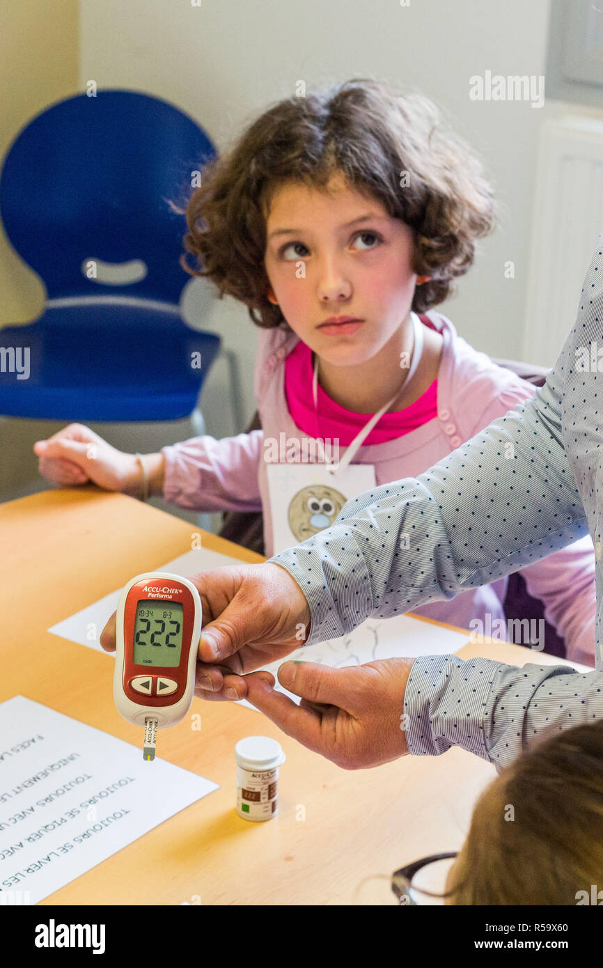 Diabetic children participating in a therapeutic education workshop animated by a nurse ...