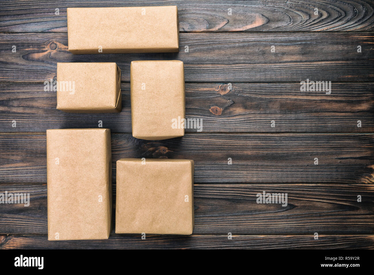 cardboard box on white wooden background vintage, toned, Brown mail ...