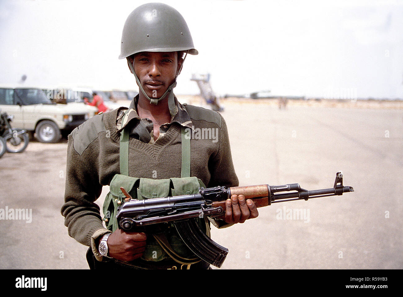 A Somalia soldier, armed with a Soviet designed AKM assault rifle ...