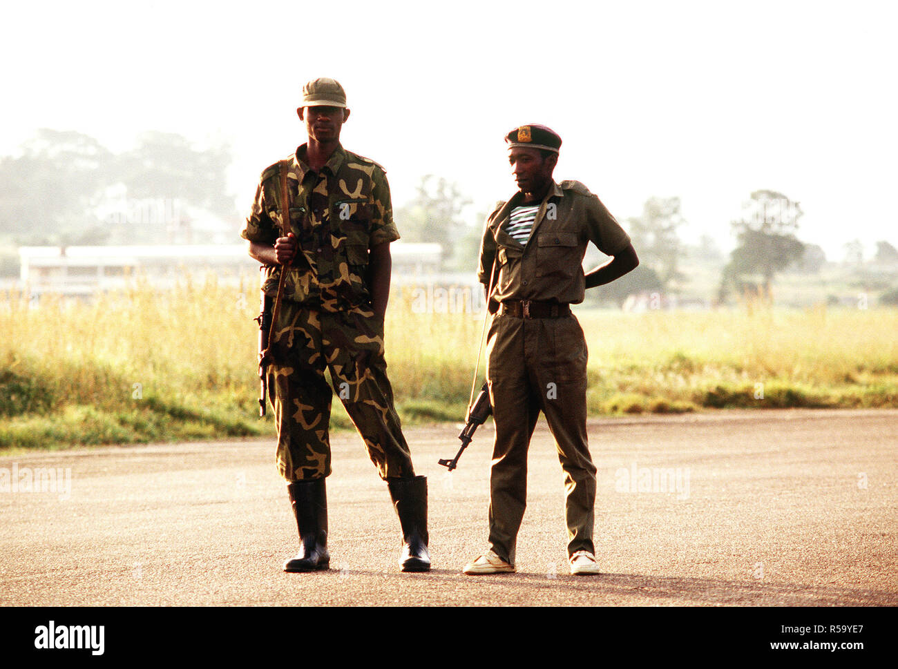 Two soldiers from the 1st Division of the Uganda National Resistance ...