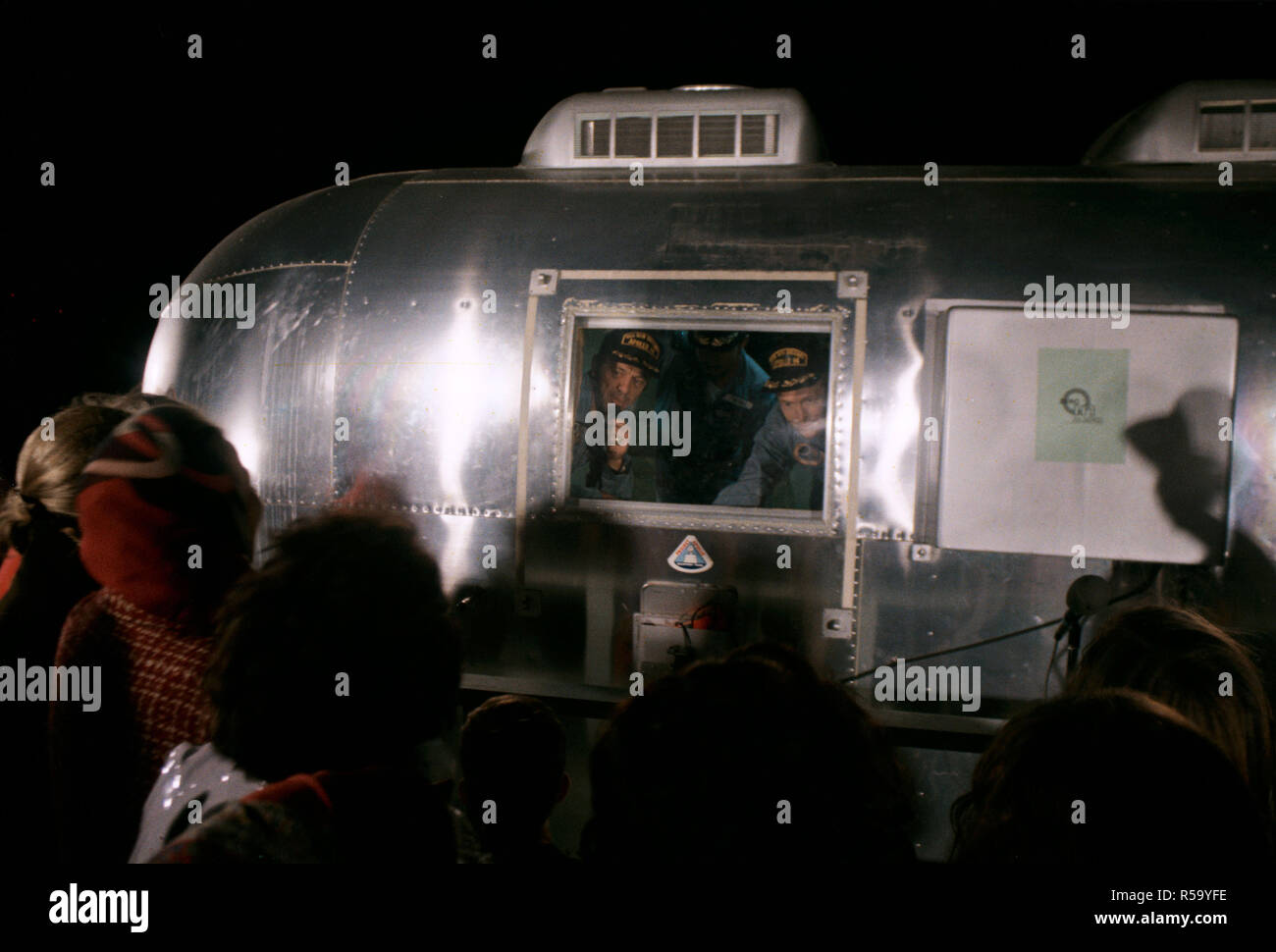 Looking through the MQF window are astronauts Alan B. Shepard Jr. (left ...