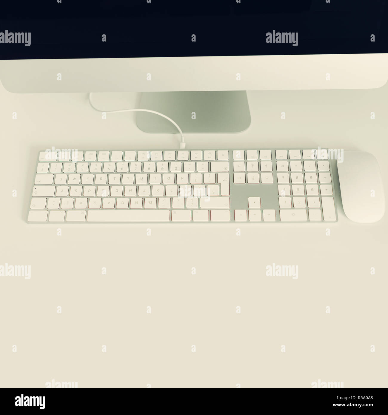 Keyboard, mouse, computer display with black blank screen. Front view ...