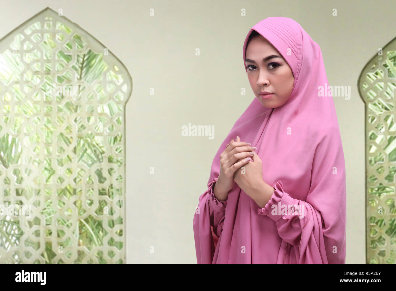 Young asian muslim woman with hijab praying to god Stock Photo - Alamy