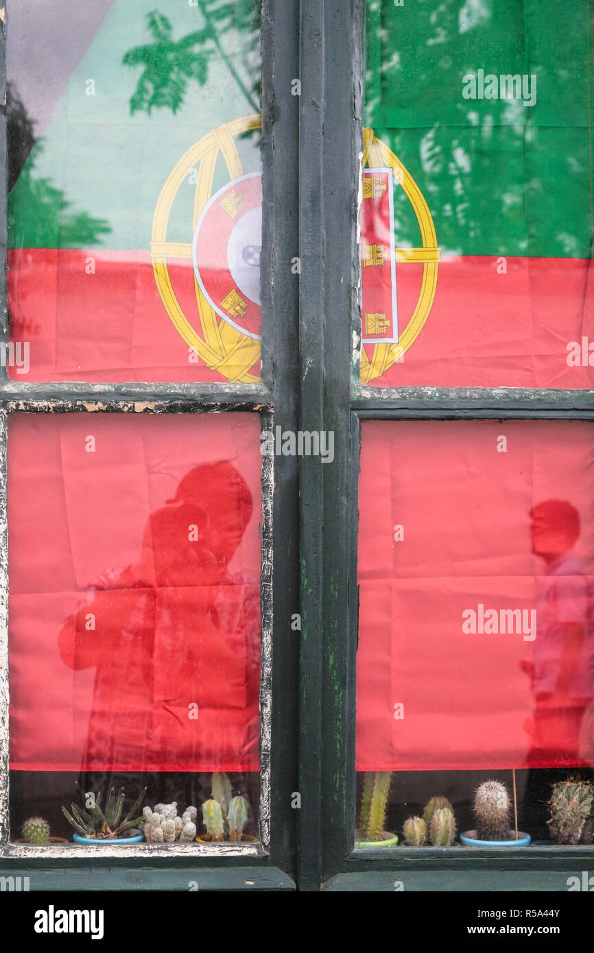 The Flag of Portugal in window in Faro city Stock Photo - Alamy