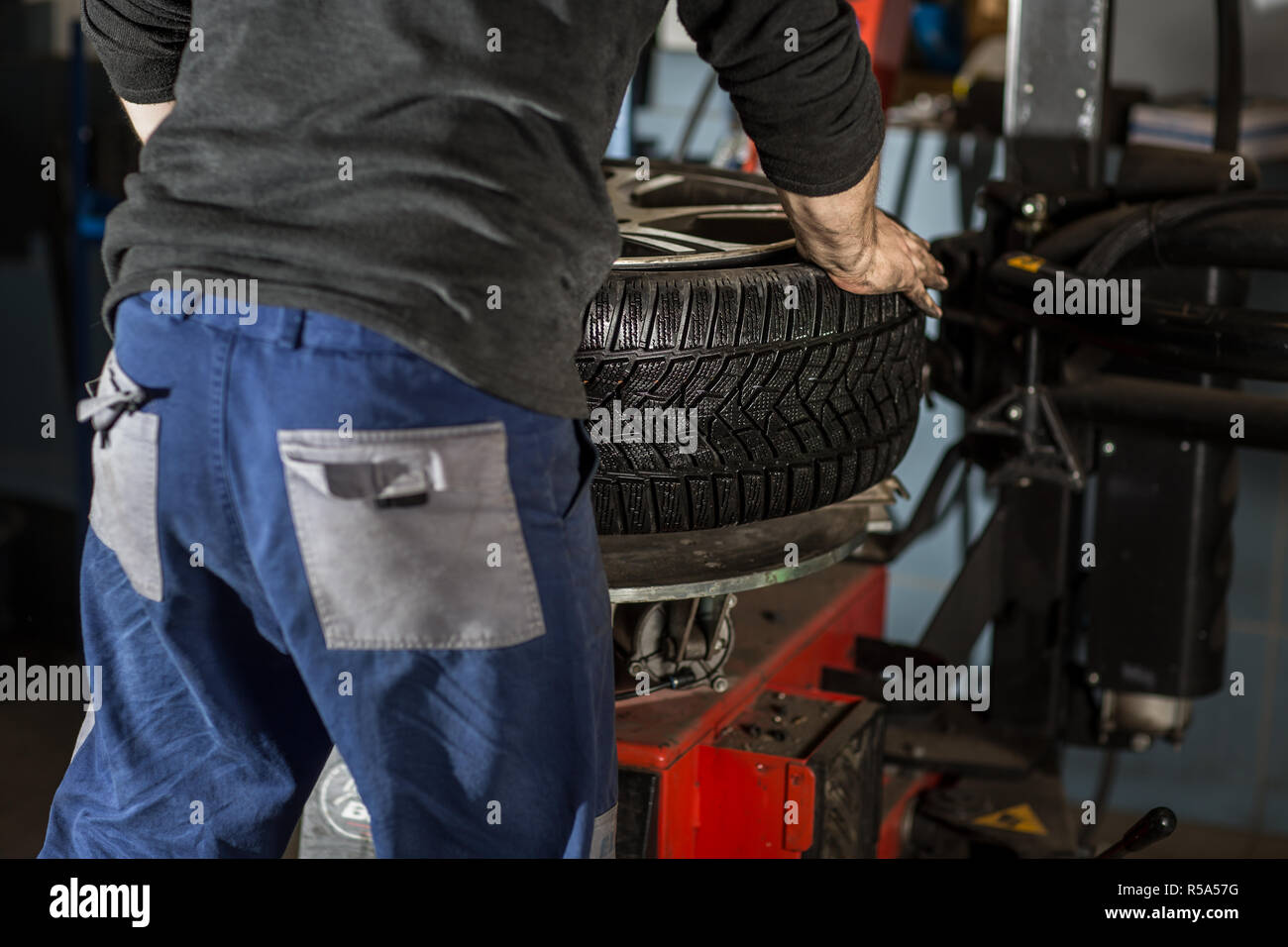 Inside a garage - modern car waiting for the mechanic to change its ...