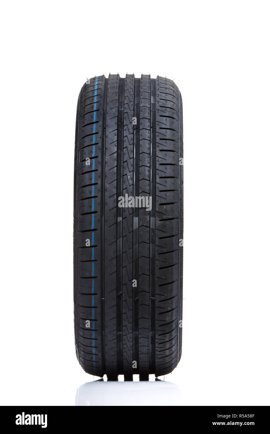 Stack of brand new high performance car tires on clean high-key white ...