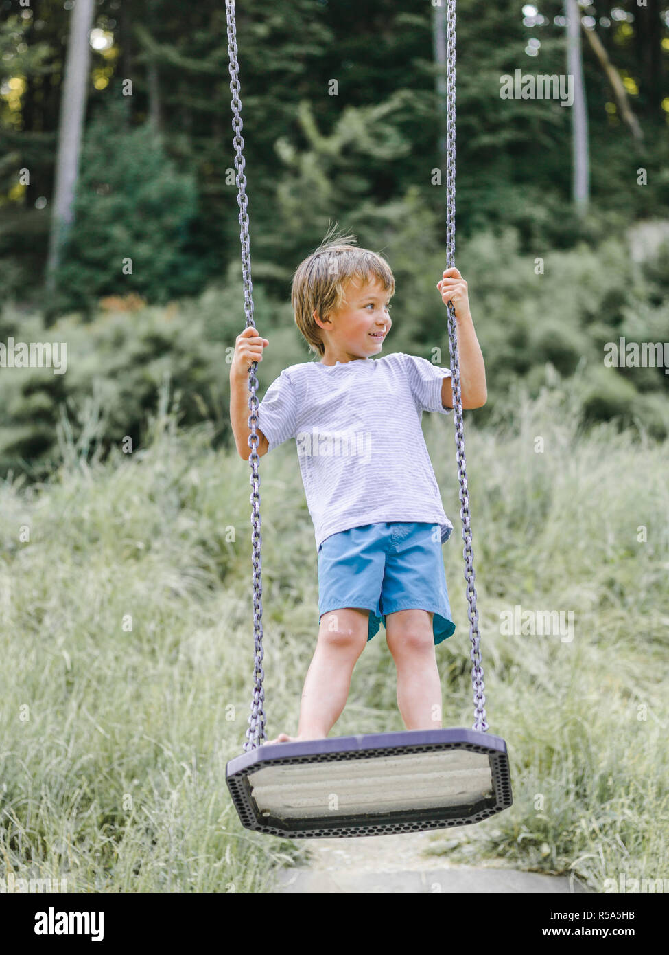child,boy,boy plays on a children playground Stock Photo - Alamy