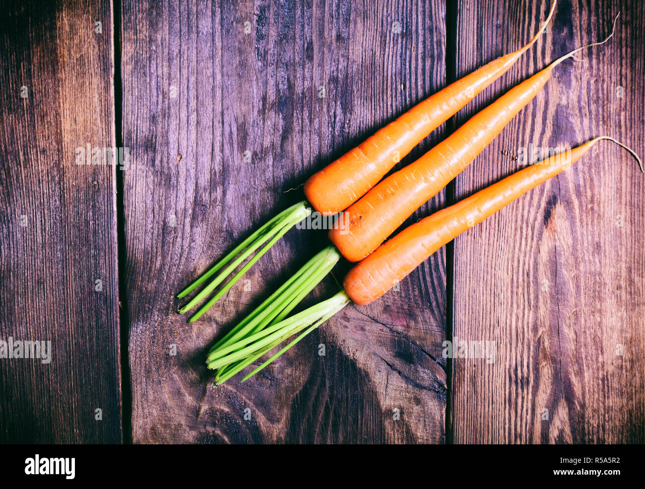 Three fresh carrots Stock Photo - Alamy