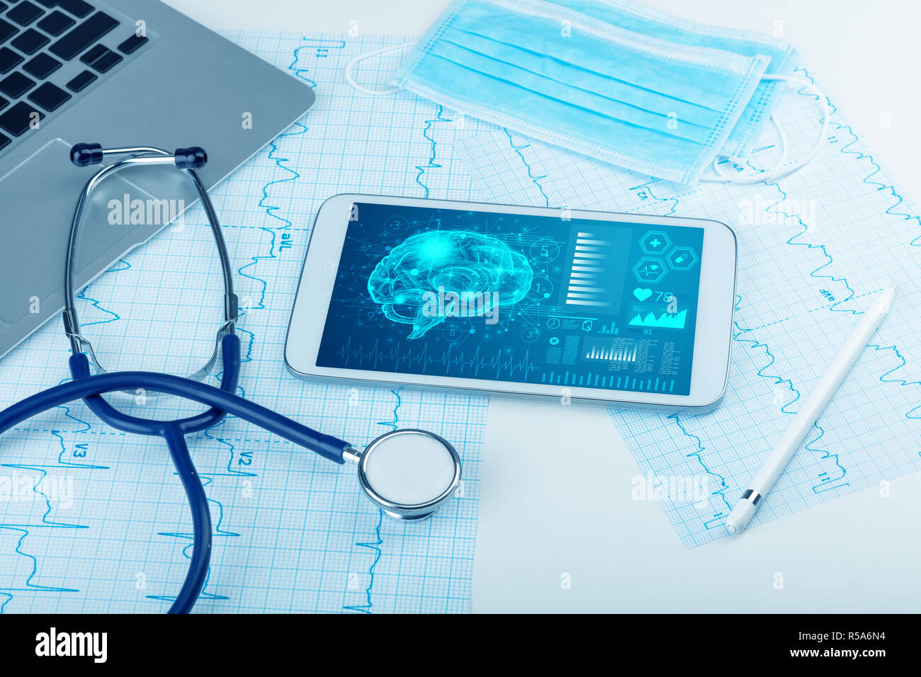 Brain functionality report with medical devices around Stock Photo - Alamy