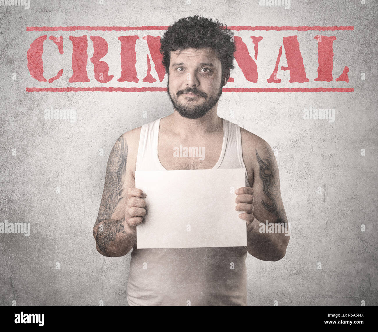 Caught gangster with criminal background Stock Photo - Alamy