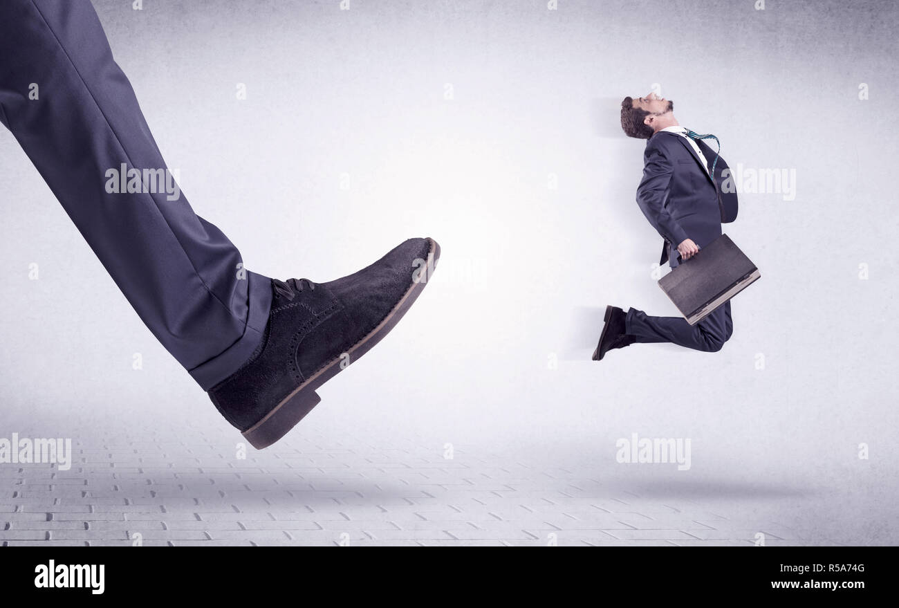 Businessman kicked hi-res stock photography and images - Alamy