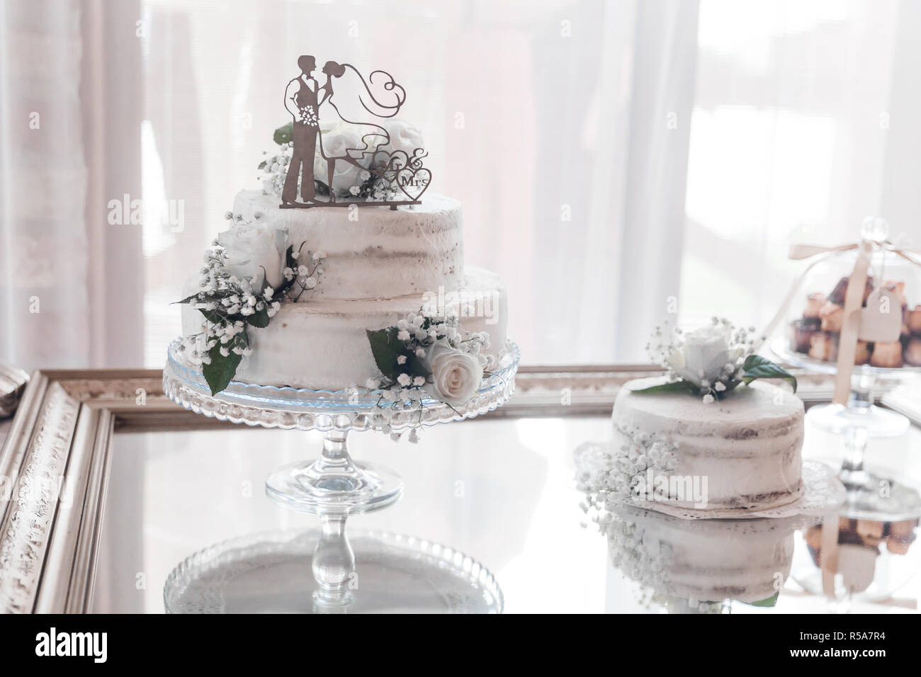 Wedding cake of the bride and groom, wedding day Stock Photo - Alamy