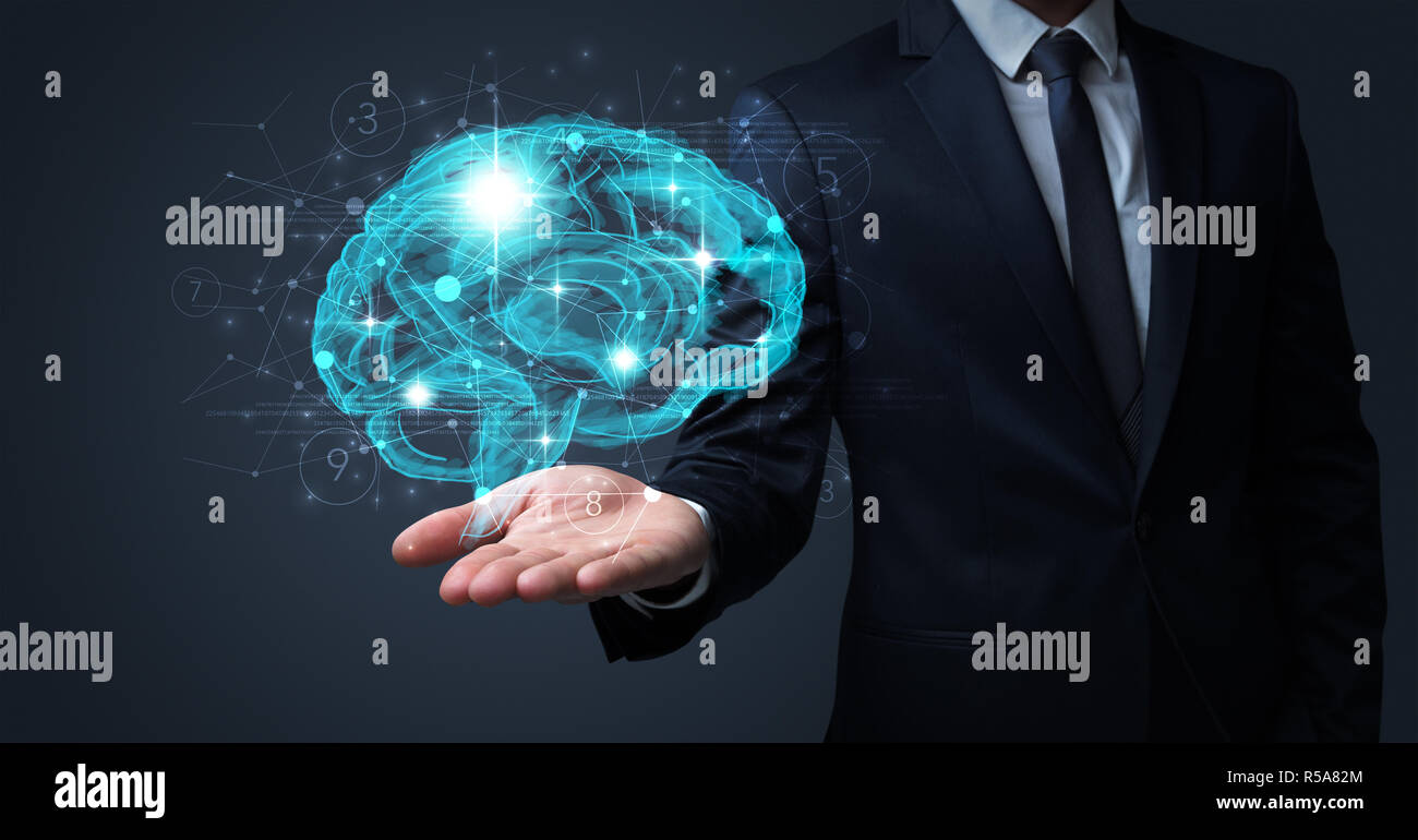 Businessman holding human brain on his hand with logistics symbols ...