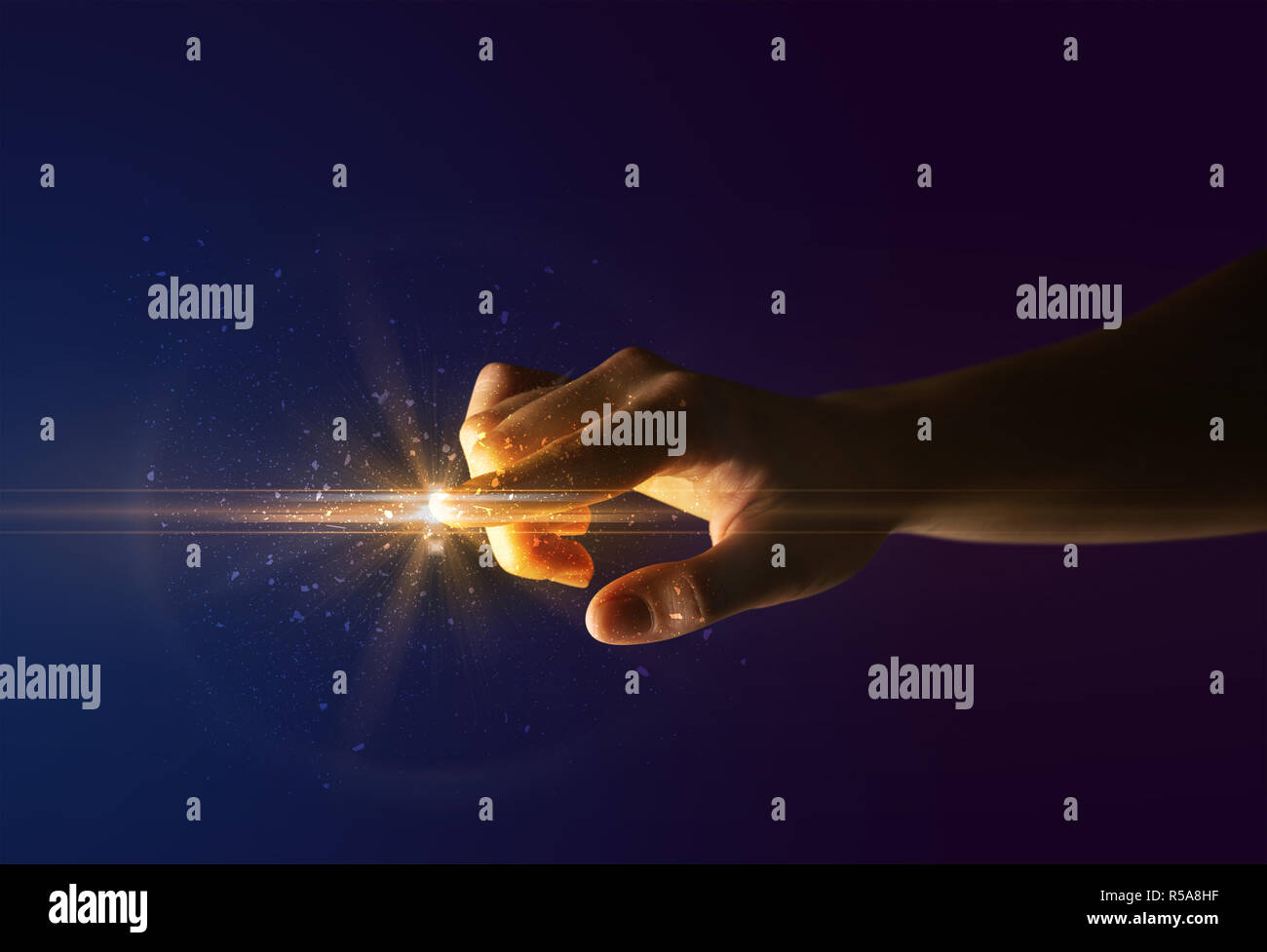 Female finger touching a beam of light Stock Photo - Alamy
