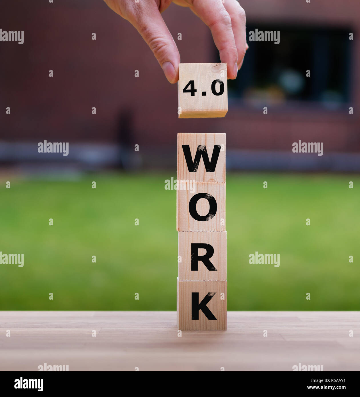 Cubes form the word "WORK 4.0 Stock Photo - Alamy