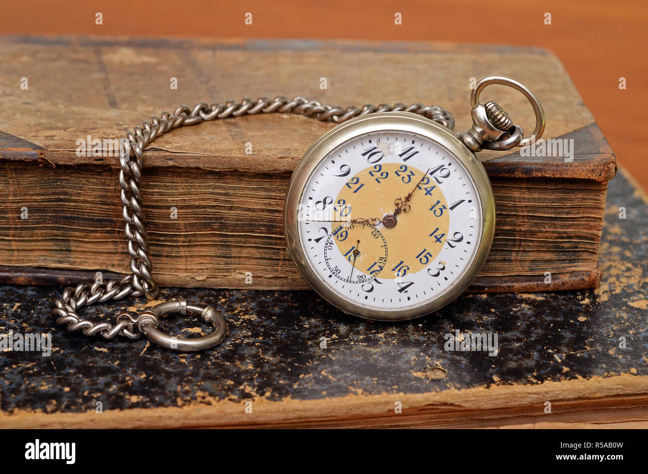 old pocket watch and books Stock Photo - Alamy