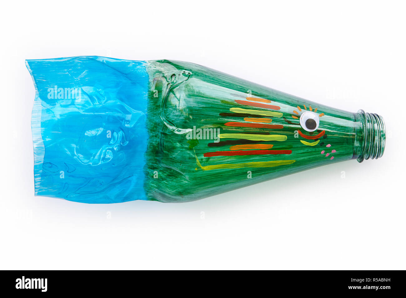 Plastic bottle recycled in a fish figure. Reuse garbage. Isolated Stock ...