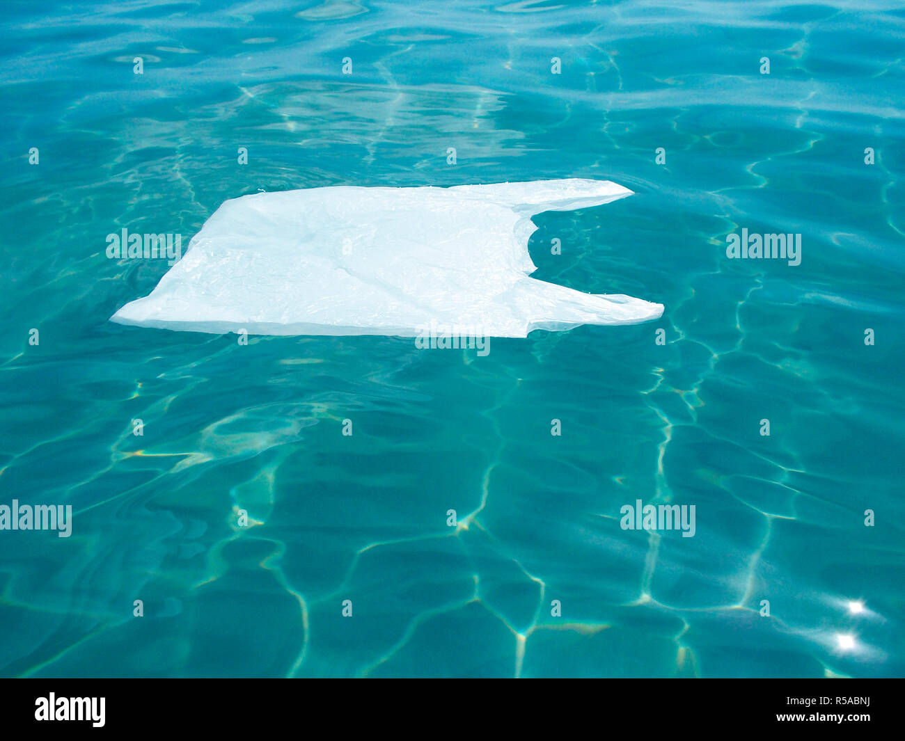 Plastic bag floating into the sea. Polluted environmental. Recycle ...