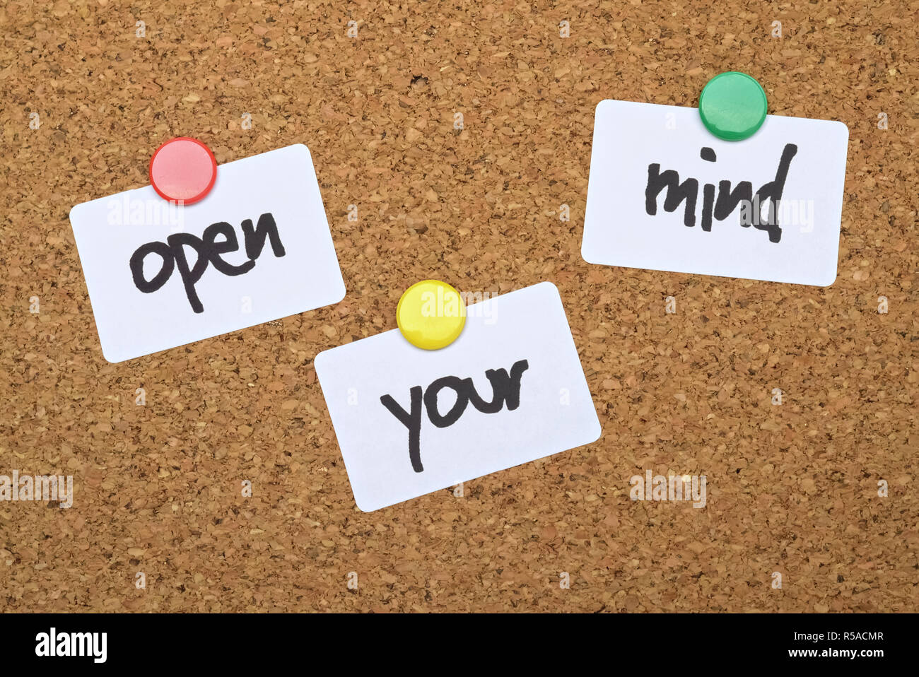 Text Open Your Mind written on pinned white stickers Stock Photo - Alamy