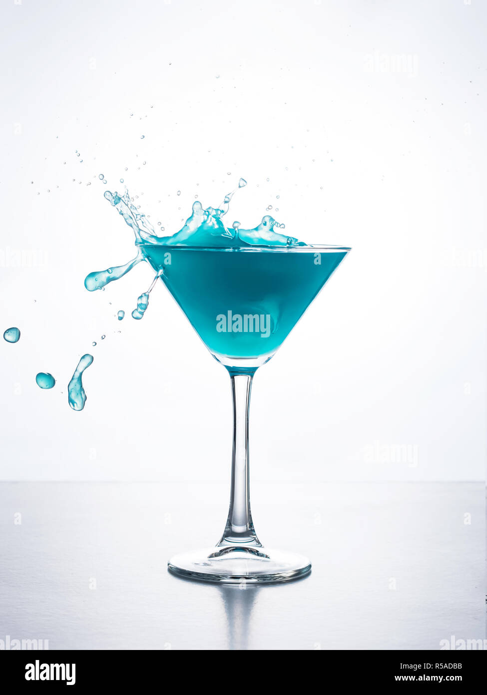 Blue curacao cocktail with splash Stock Photo - Alamy