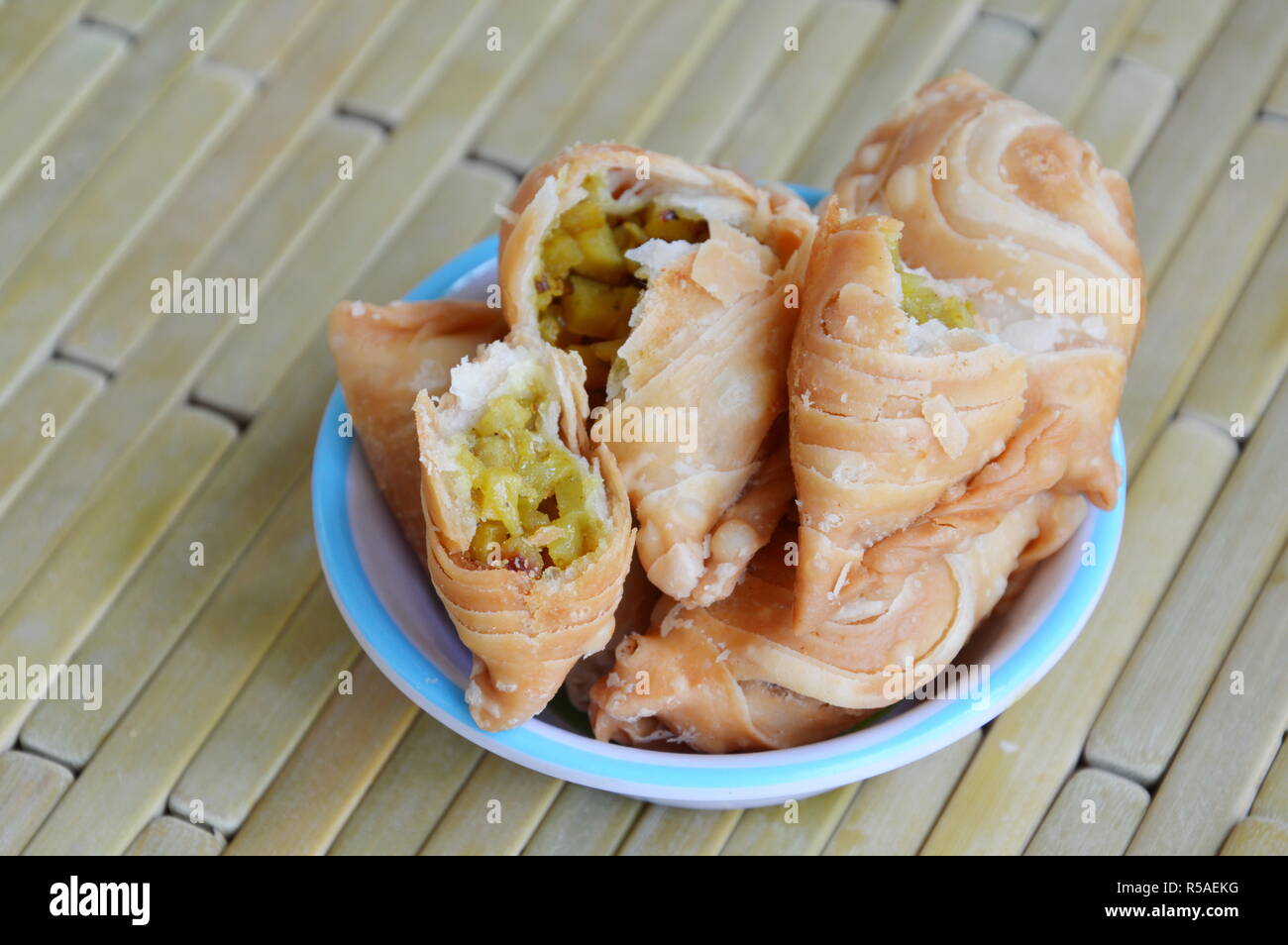 mini chicken filled curry puff on the cup Stock Photo - Alamy