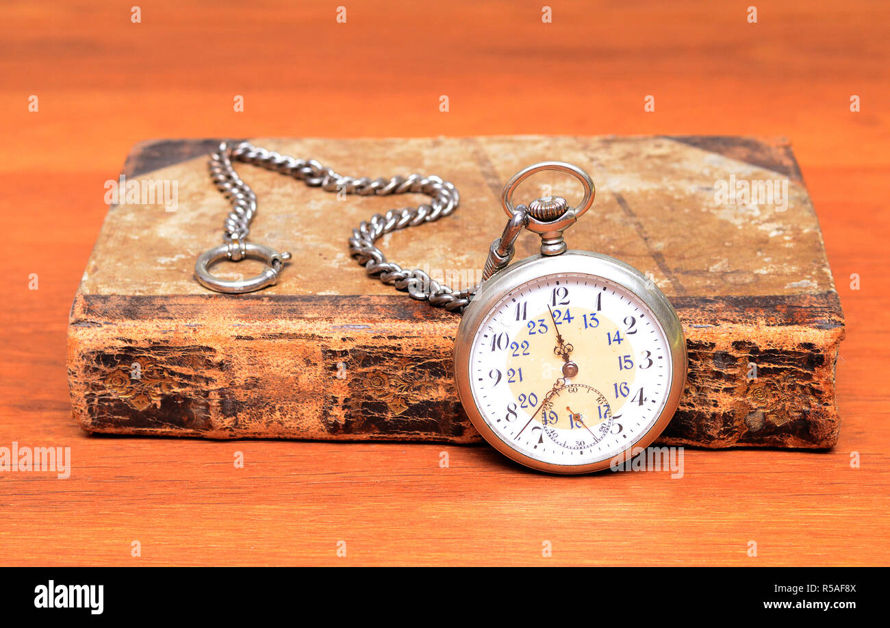 Pocket watch and book hi-res stock photography and images - Alamy