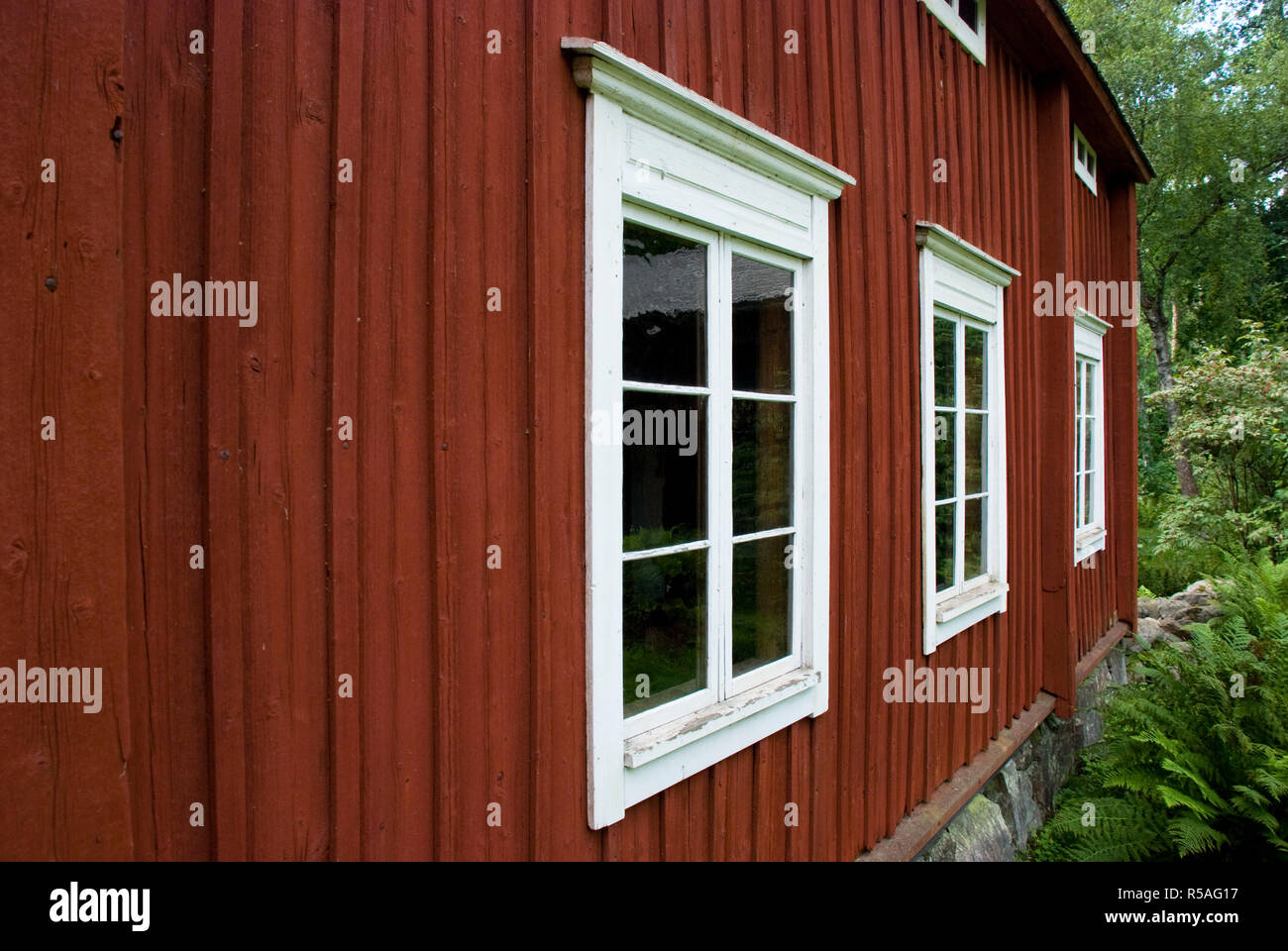 red wooden house in scandinavia Stock Photo - Alamy