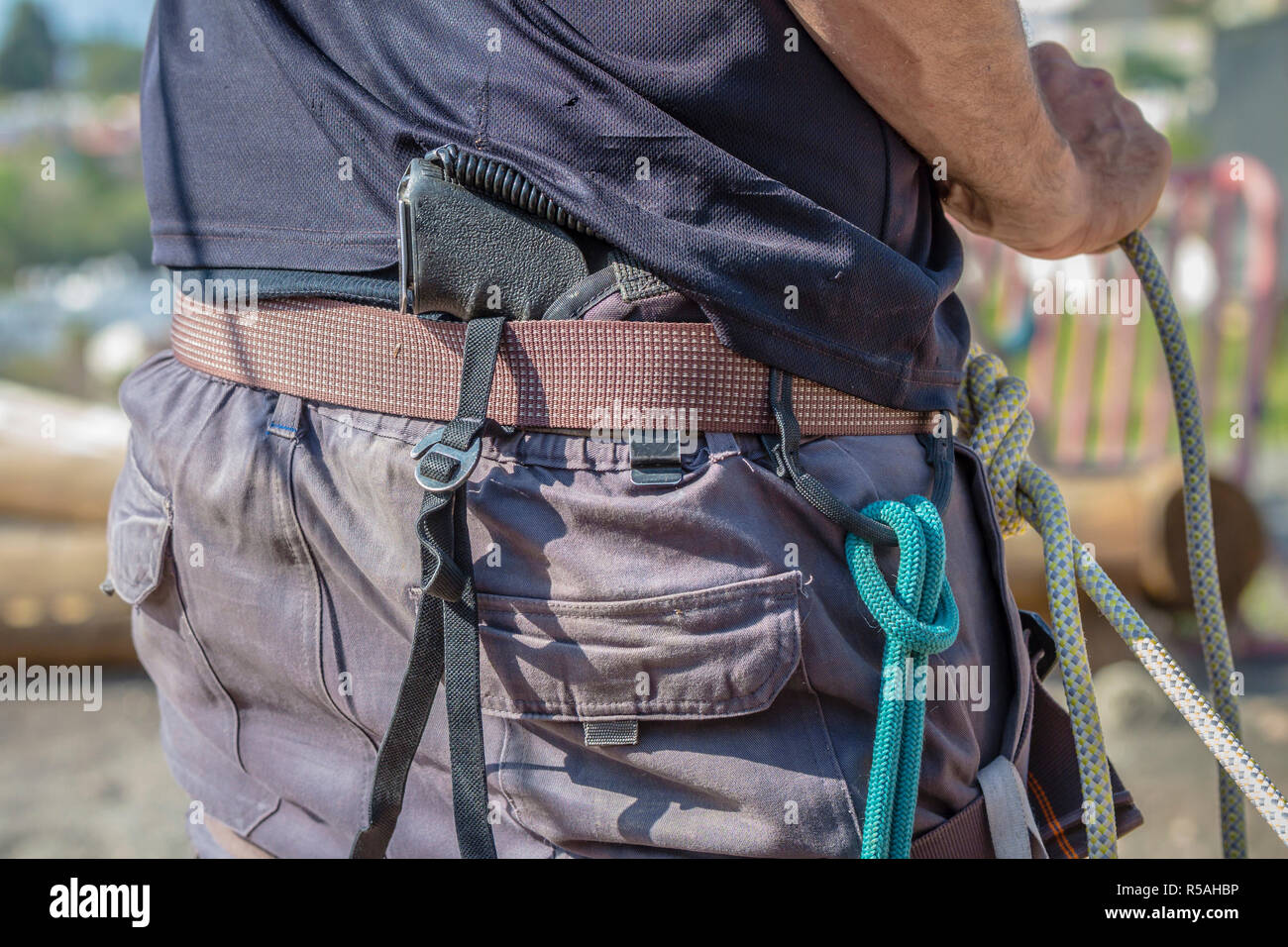 Man conceals gun behind his back Stock Photo - Alamy