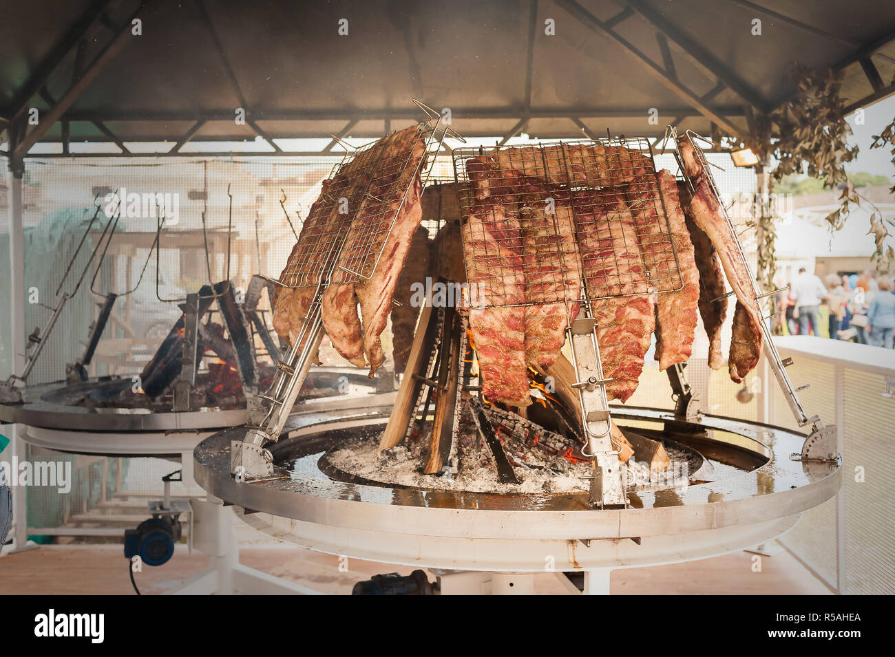 Roasted meat of beef cooked on a vertical grills Stock Photo - Alamy