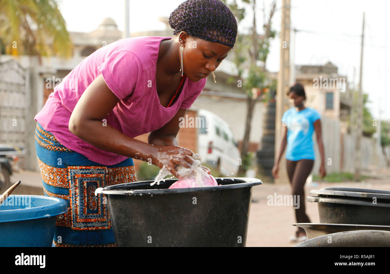 Woman is cleaning her clothes, laundry Stock Photo - Alamy
