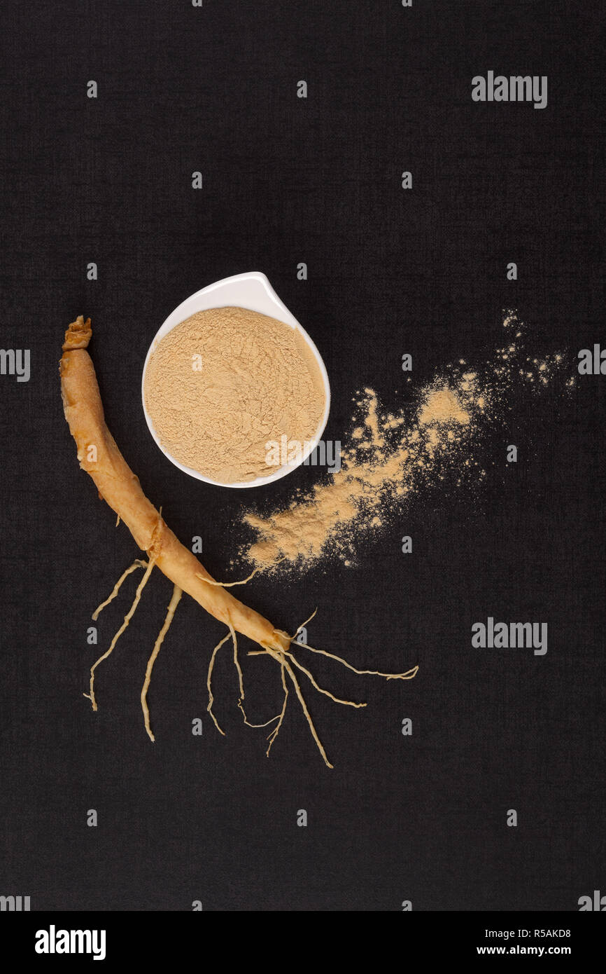 Ginseng root with powder, top view Stock Photo - Alamy