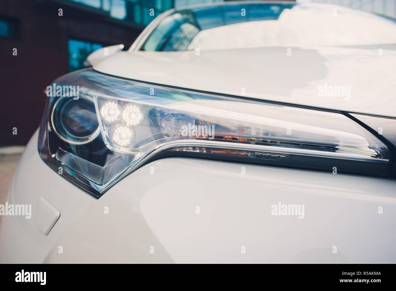 Led car headlight close-up. New modern vehicle detail light Stock Photo ...