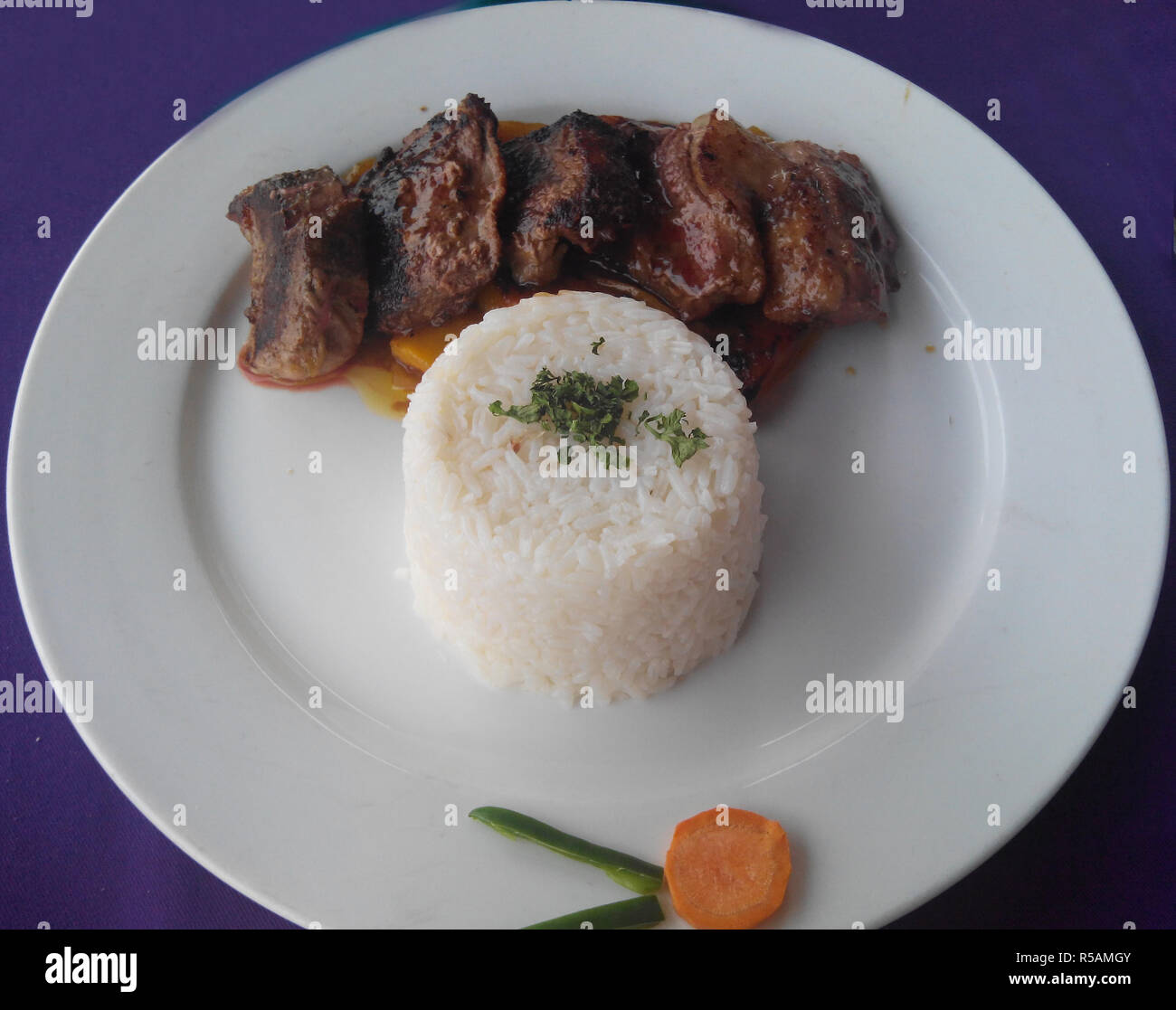 Goat meat with rice Stock Photo - Alamy