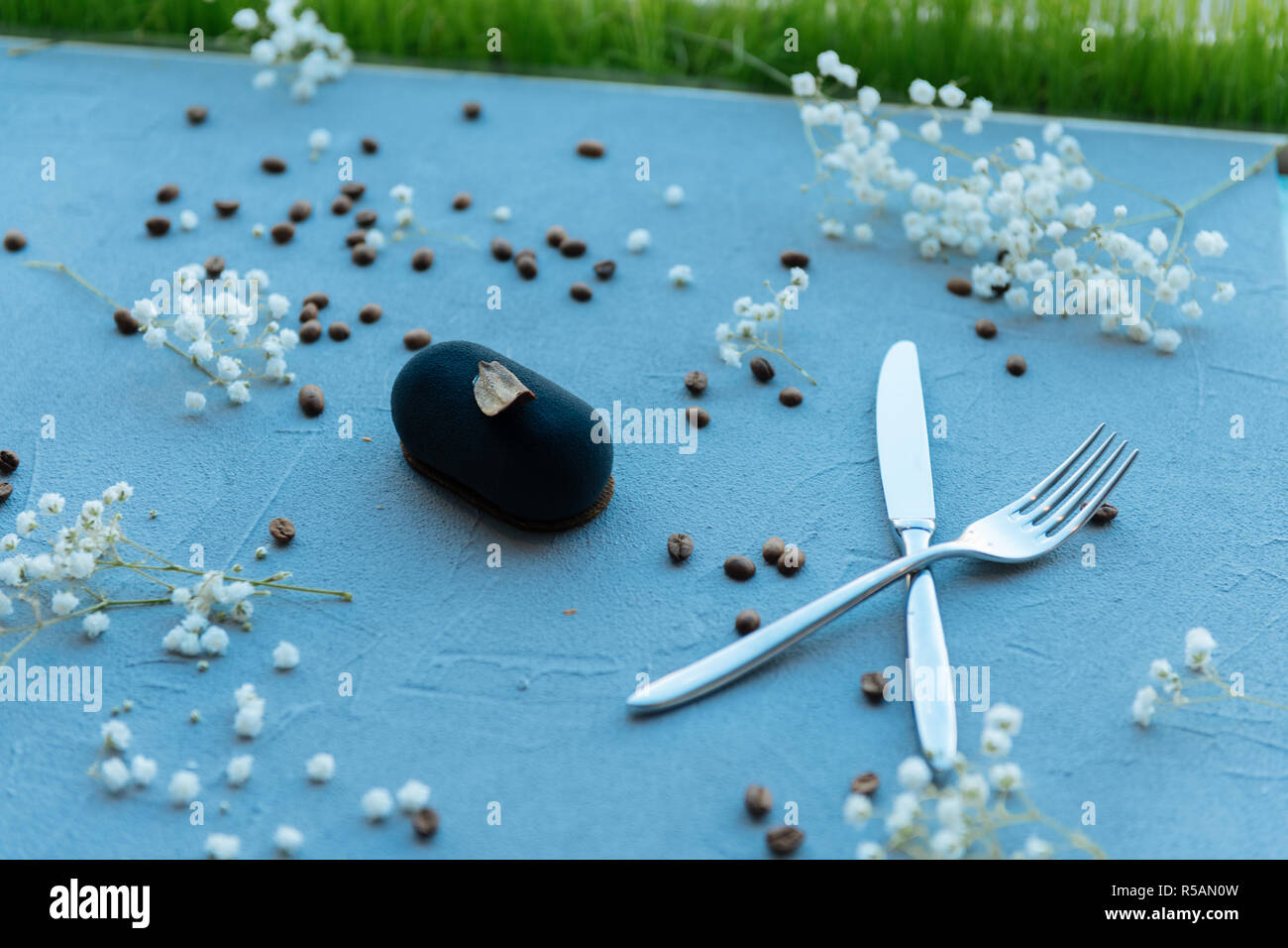 Best bakery. Close up of a tasty blue cake being served in the bakery ...