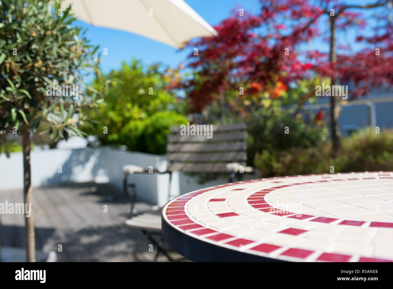 empty round table on a summer terrace Stock Photo - Alamy