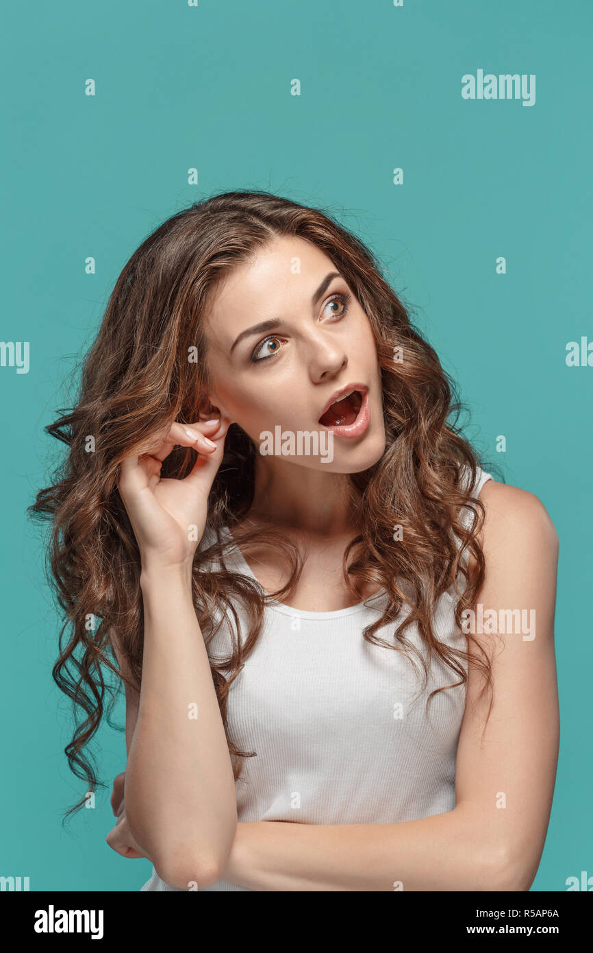 Portrait of young woman with shocked facial expression Stock Photo - Alamy