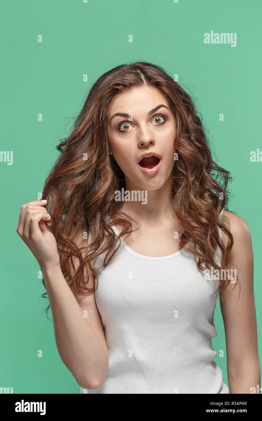 Portrait of young woman with shocked facial expression Stock Photo - Alamy