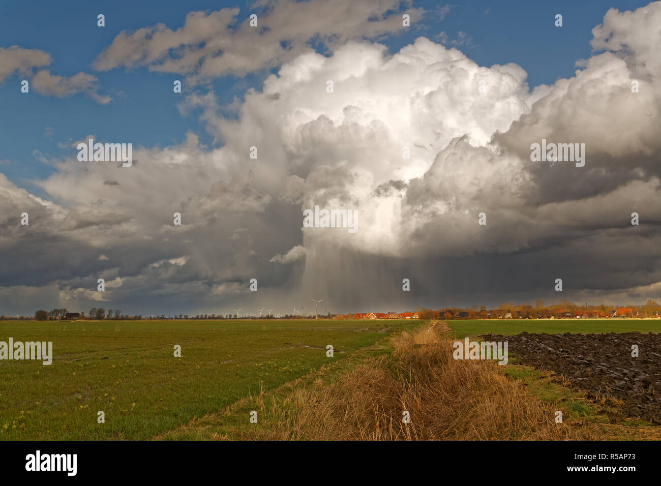 rain clouds are traversing the land Stock Photo - Alamy