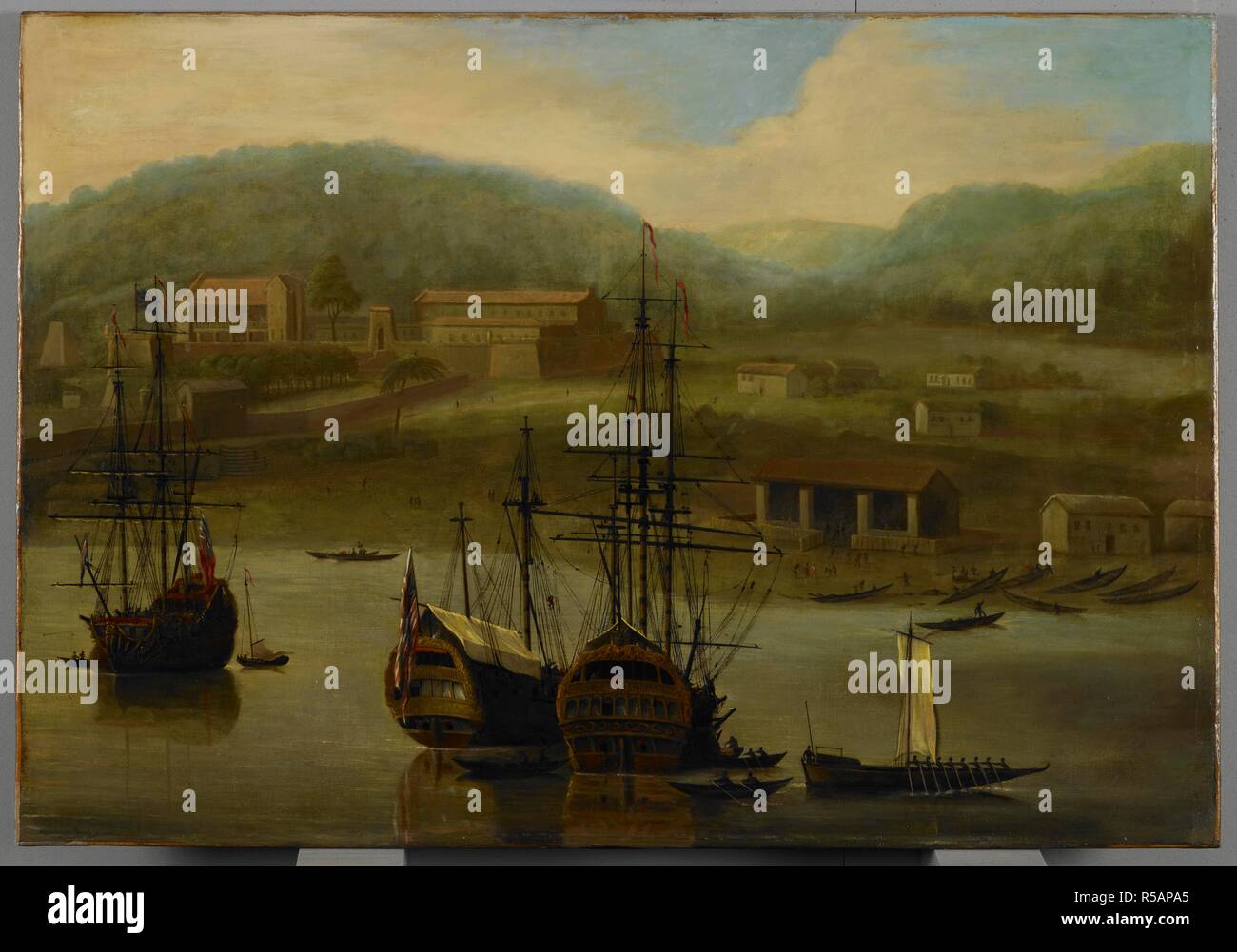 Tellicherry, Kerala. A large goods-shed stands near the shore and a few ...