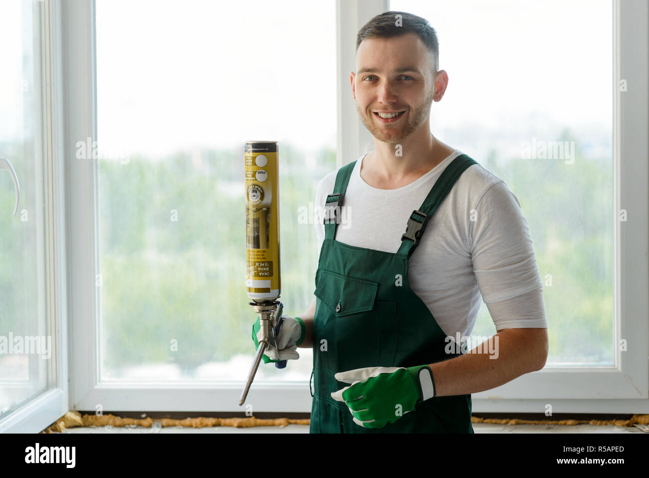 Portrait of a smiling worker Stock Photo - Alamy