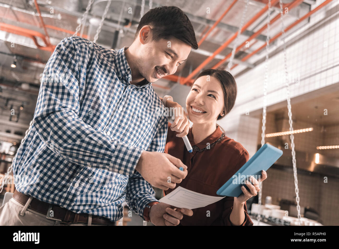Loving good-looking couple enjoying freelancing together Stock Photo ...