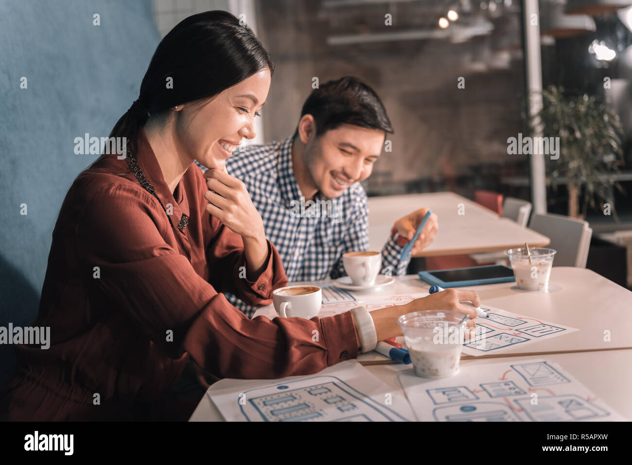 Managers meeting in cafeteria for discussing working moments Stock ...