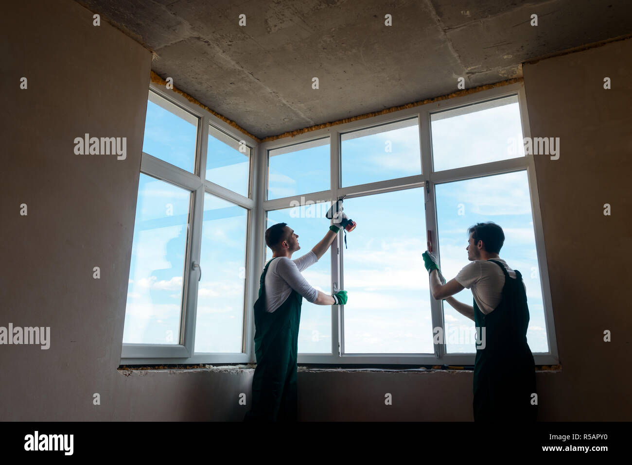 Windows installation in new building Stock Photo - Alamy