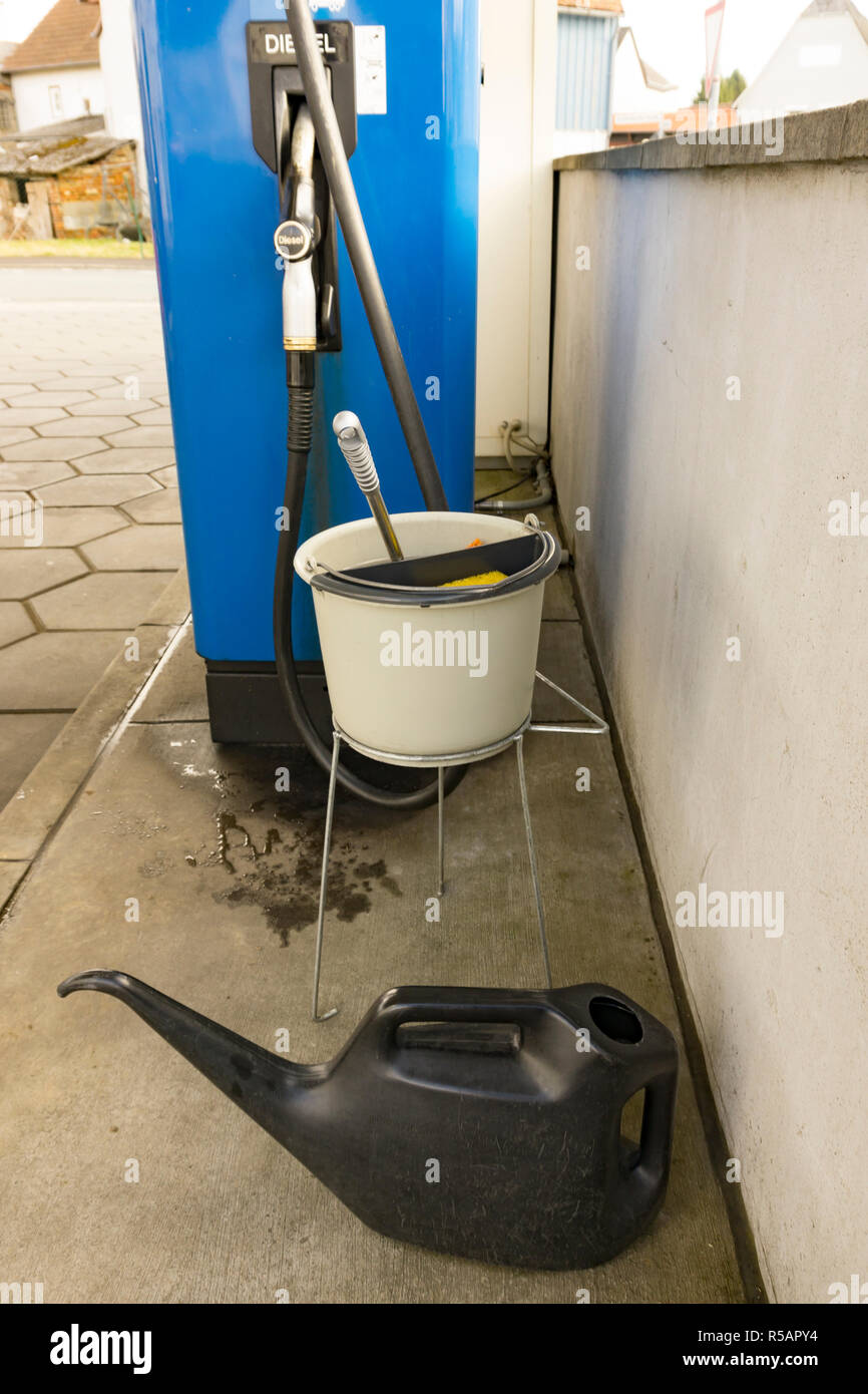 bucket of water at a gas station Stock Photo - Alamy