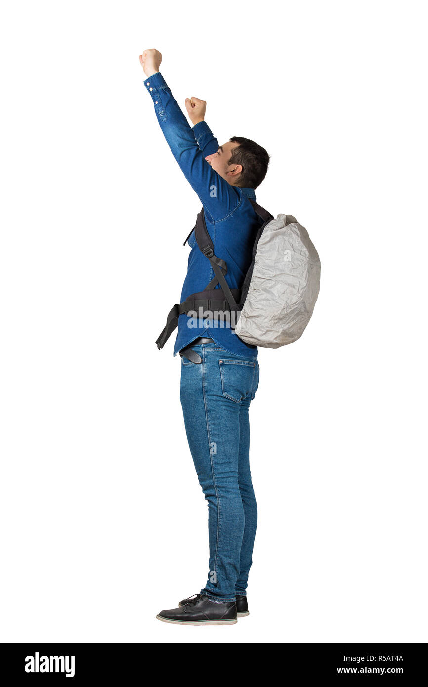 Side view full length portrait of confident young man carrying a ...