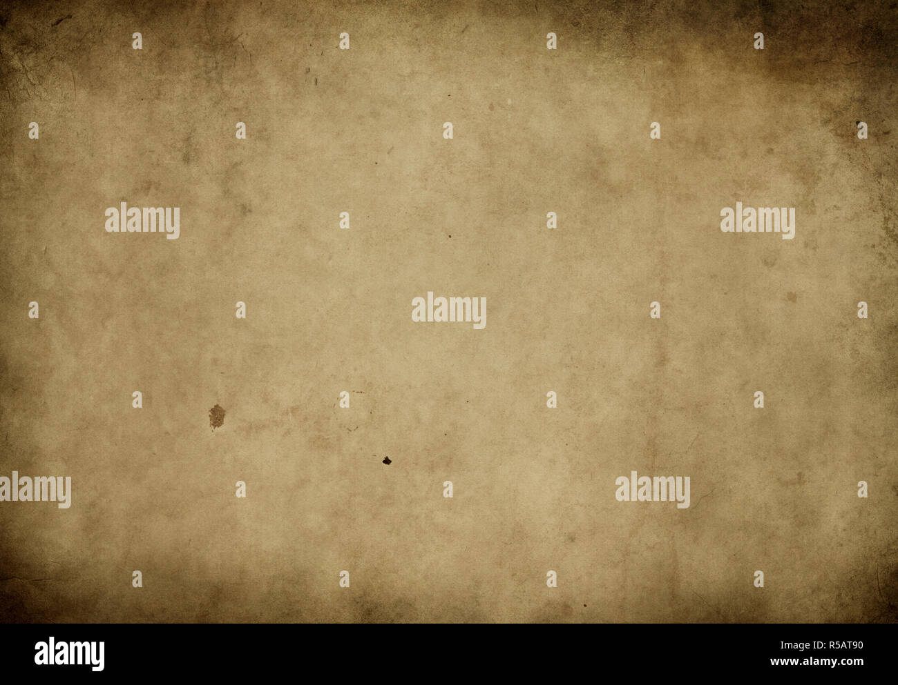 Old yellowed and dirty paper background. Grunge texture for design ...