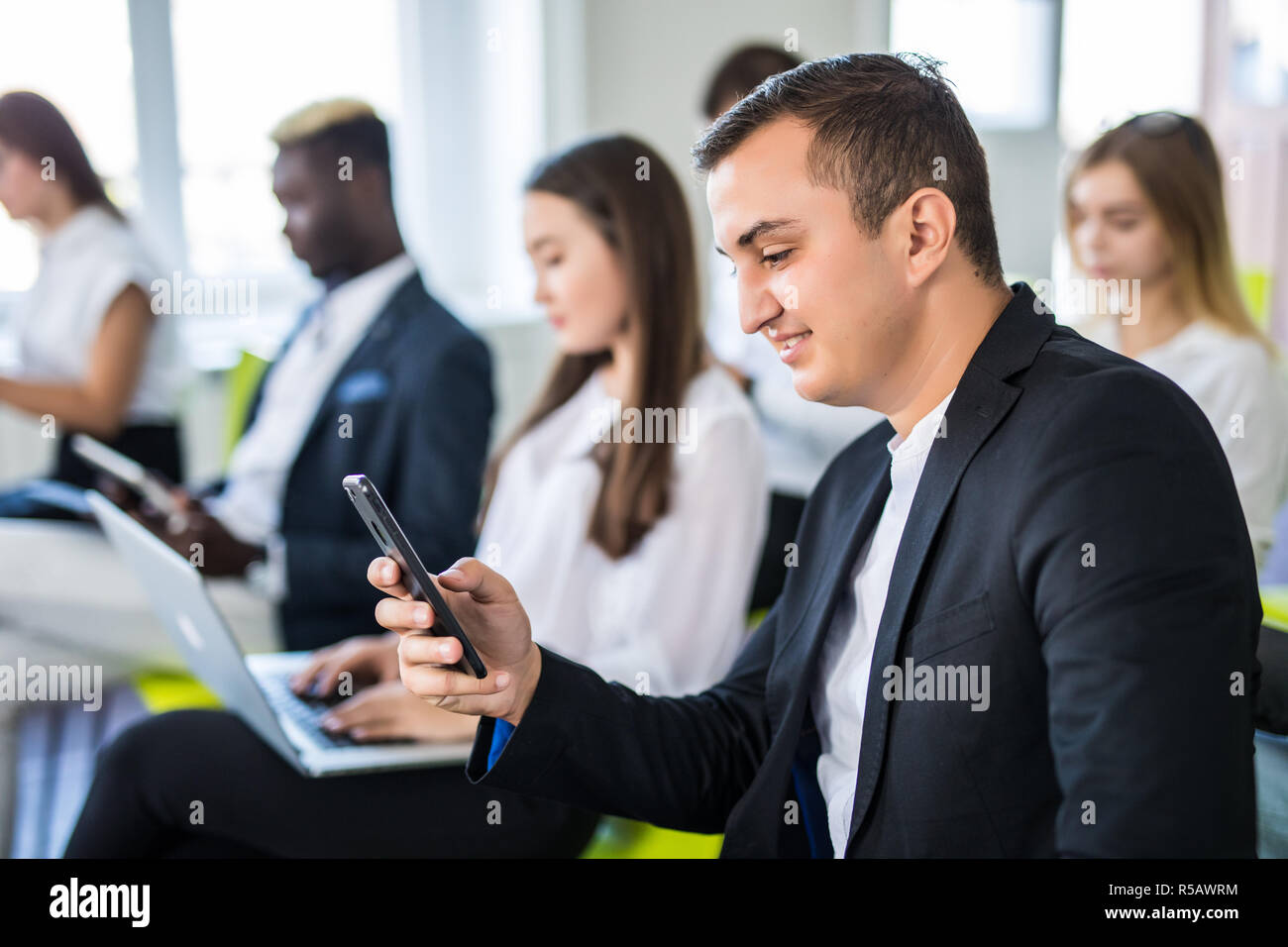 business people using gadgets during the conference Stock Photo - Alamy