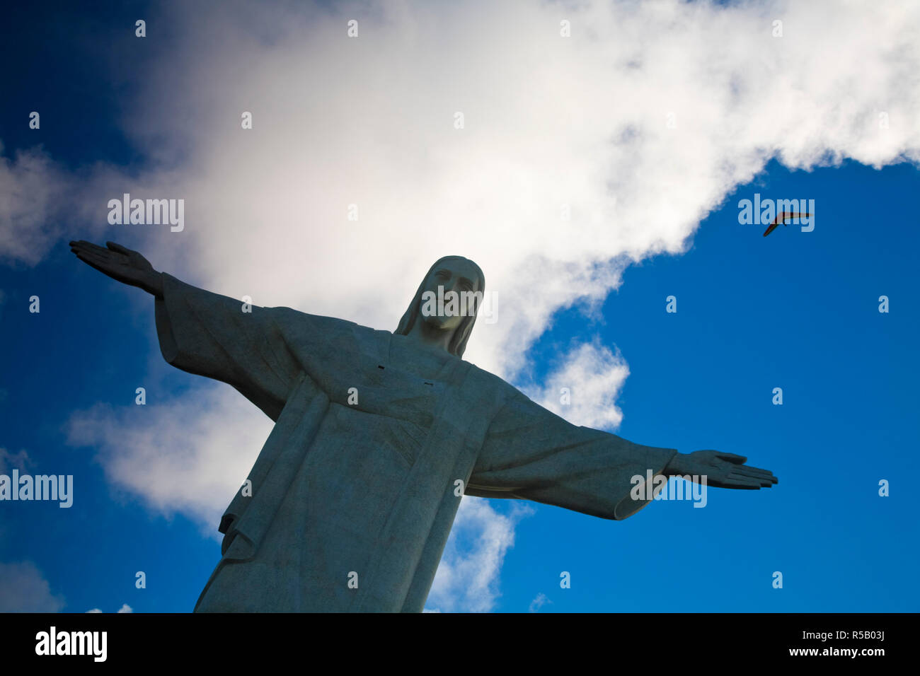 Brazil, Rio De Janeiro, Cosme Velho, Hang glider flying near Chirst The ...